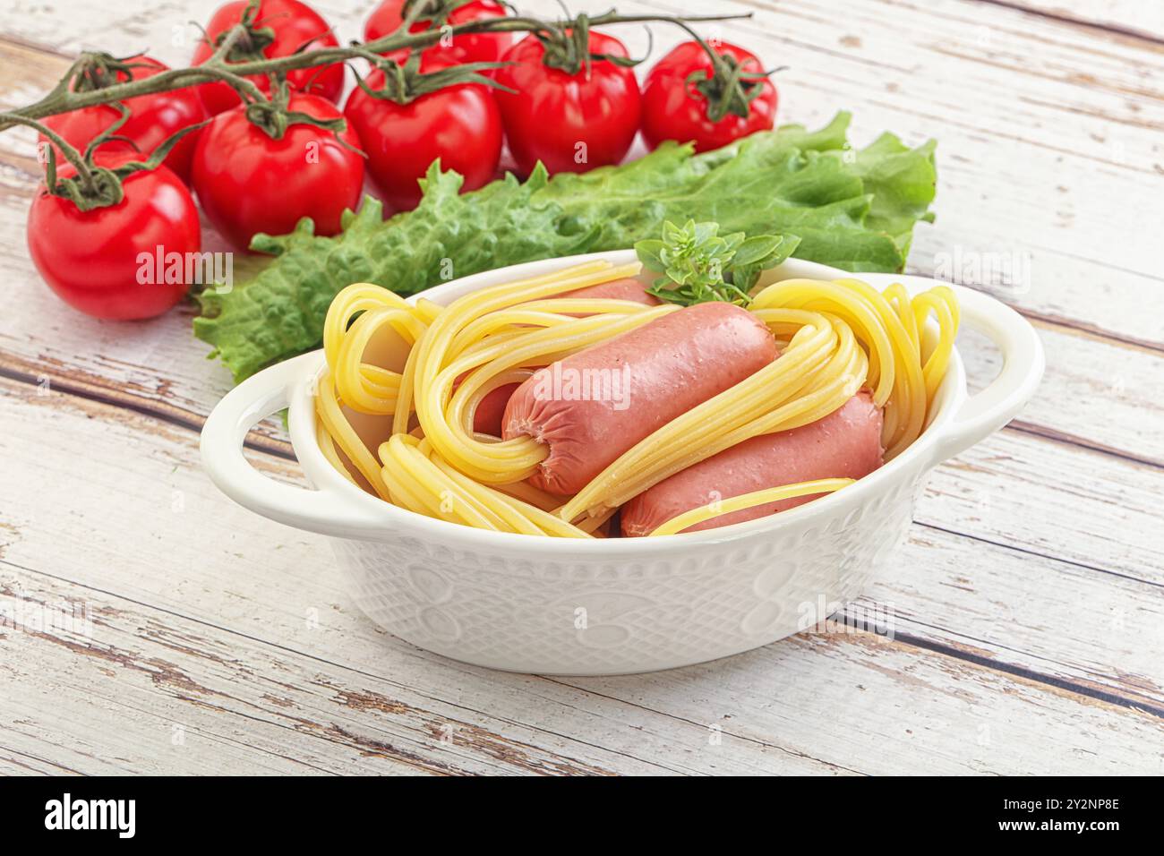 Mini sausages with pasta spaghetti for kids Stock Photo - Alamy