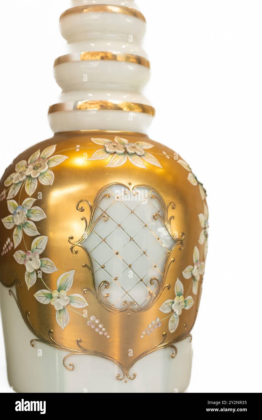 Antique decorative vase. Golden vase with golden decorative paint on a ...