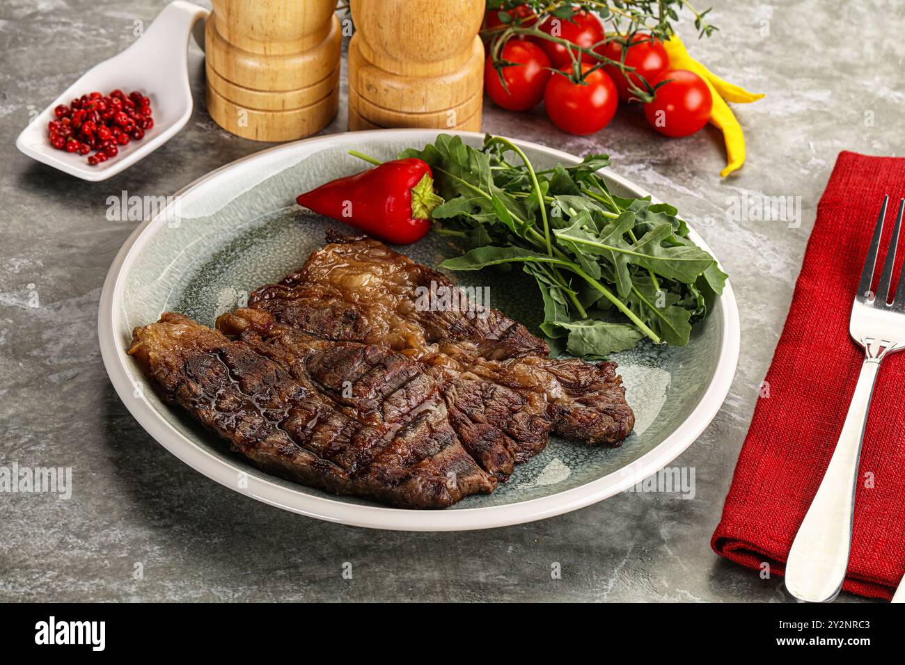 Grilled chuck roll beef steak with arugula Stock Photo - Alamy