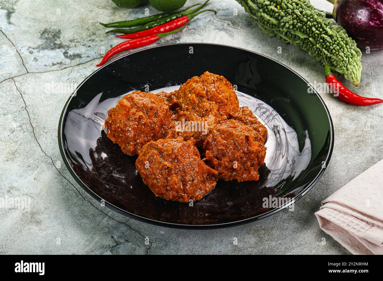 Kashmiri aloo dum - potato stuffed cheese and sauce Stock Photo - Alamy