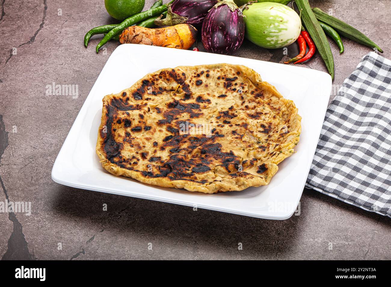 Indian cuisine stuffed Aloo paratha - bread with potato Stock Photo - Alamy