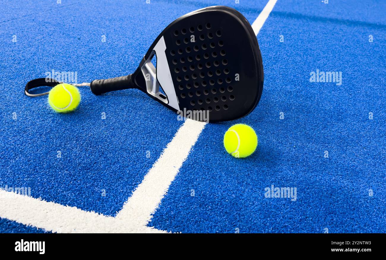 Padel tennis racket. Background with copy space. Sport court and balls ...