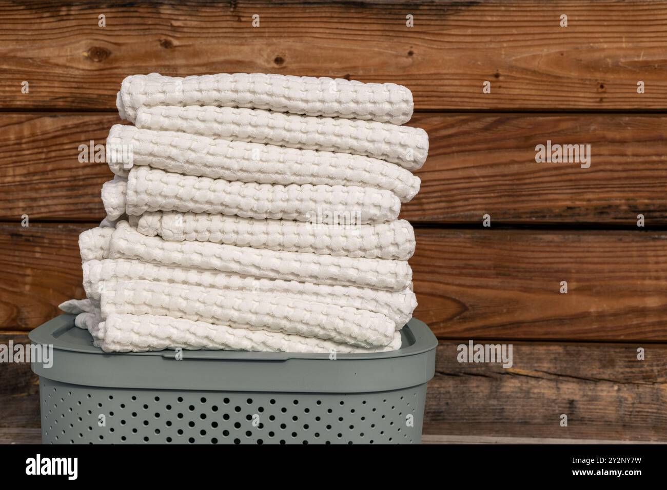 stack of clean white towels on a laundry basket Stock Photo - Alamy