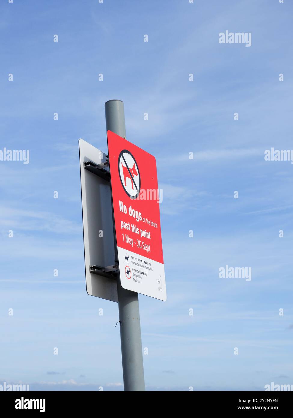 A sign on a signpost setting out restrictions for dog walking on the ...