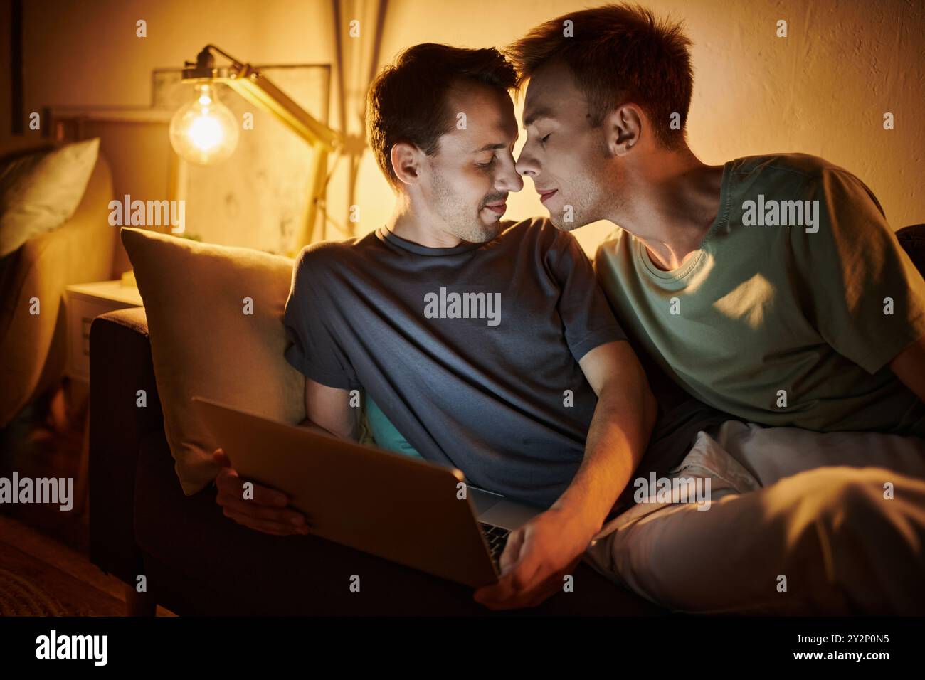 Men cuddling on sofa home hi-res stock photography and images - Alamy
