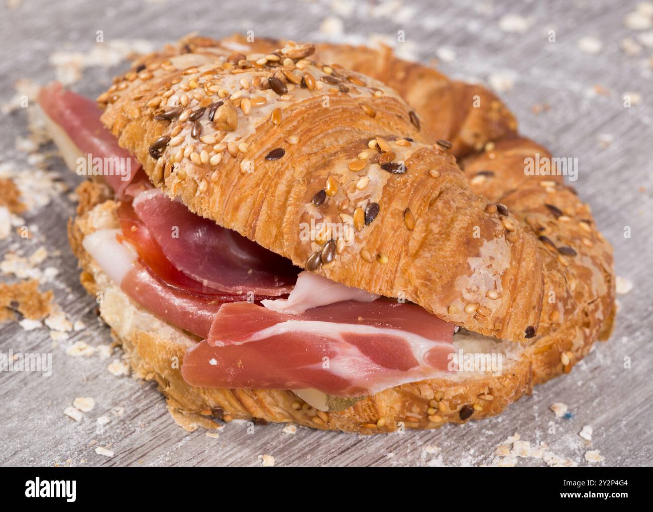 Sandwich made with croissant cheese and Parma ham Stock Photo - Alamy