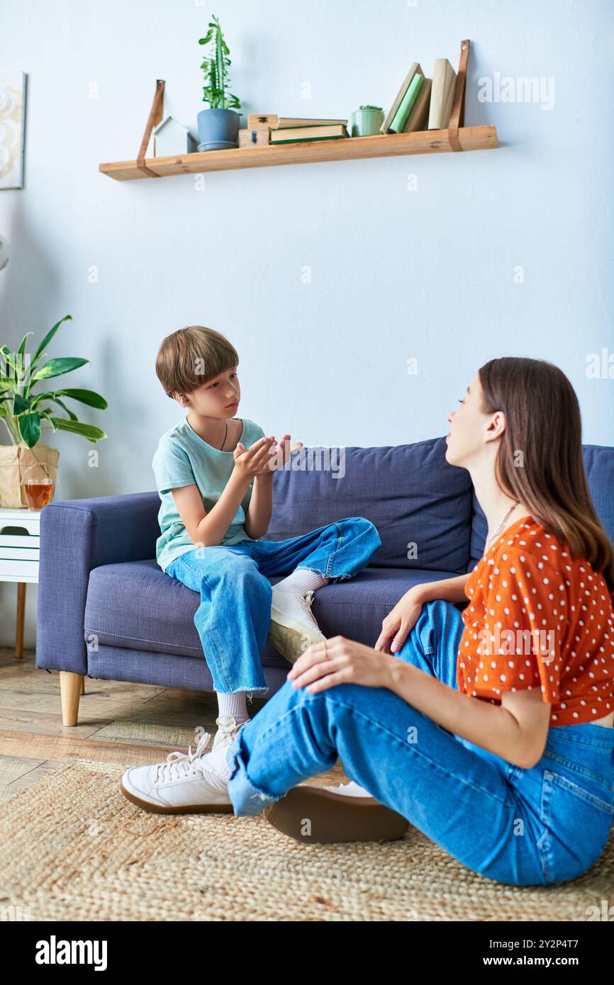 A mother engages in a heartfelt conversation with her son Stock Photo ...