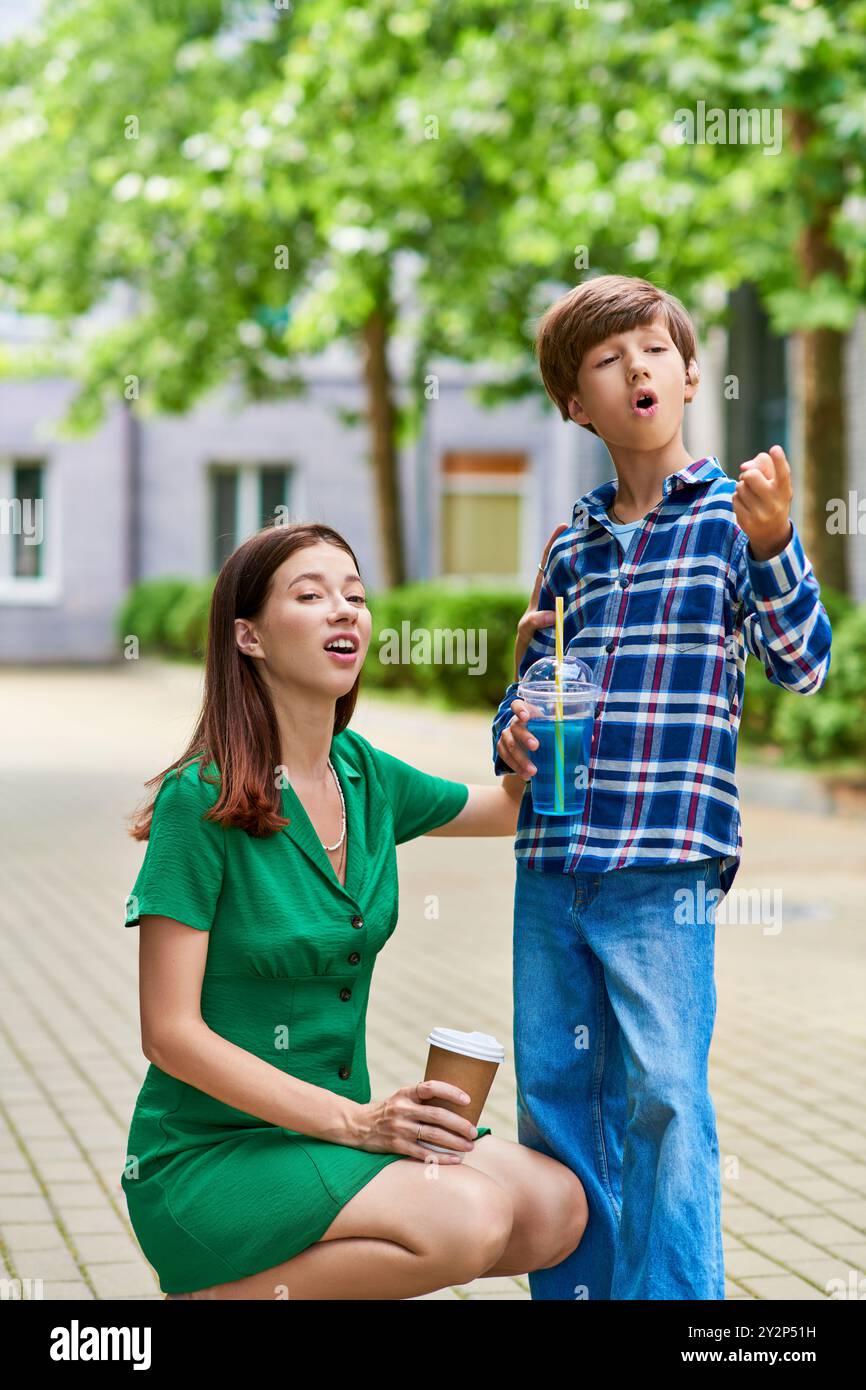 A mother and her son share a special bonding moment outdoors, filled ...