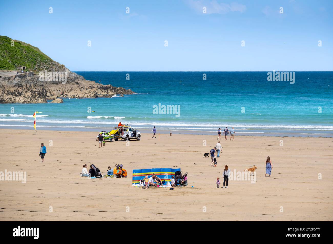 Holidaymakers enjoying the sunny weather conditions on Towan Beach in ...