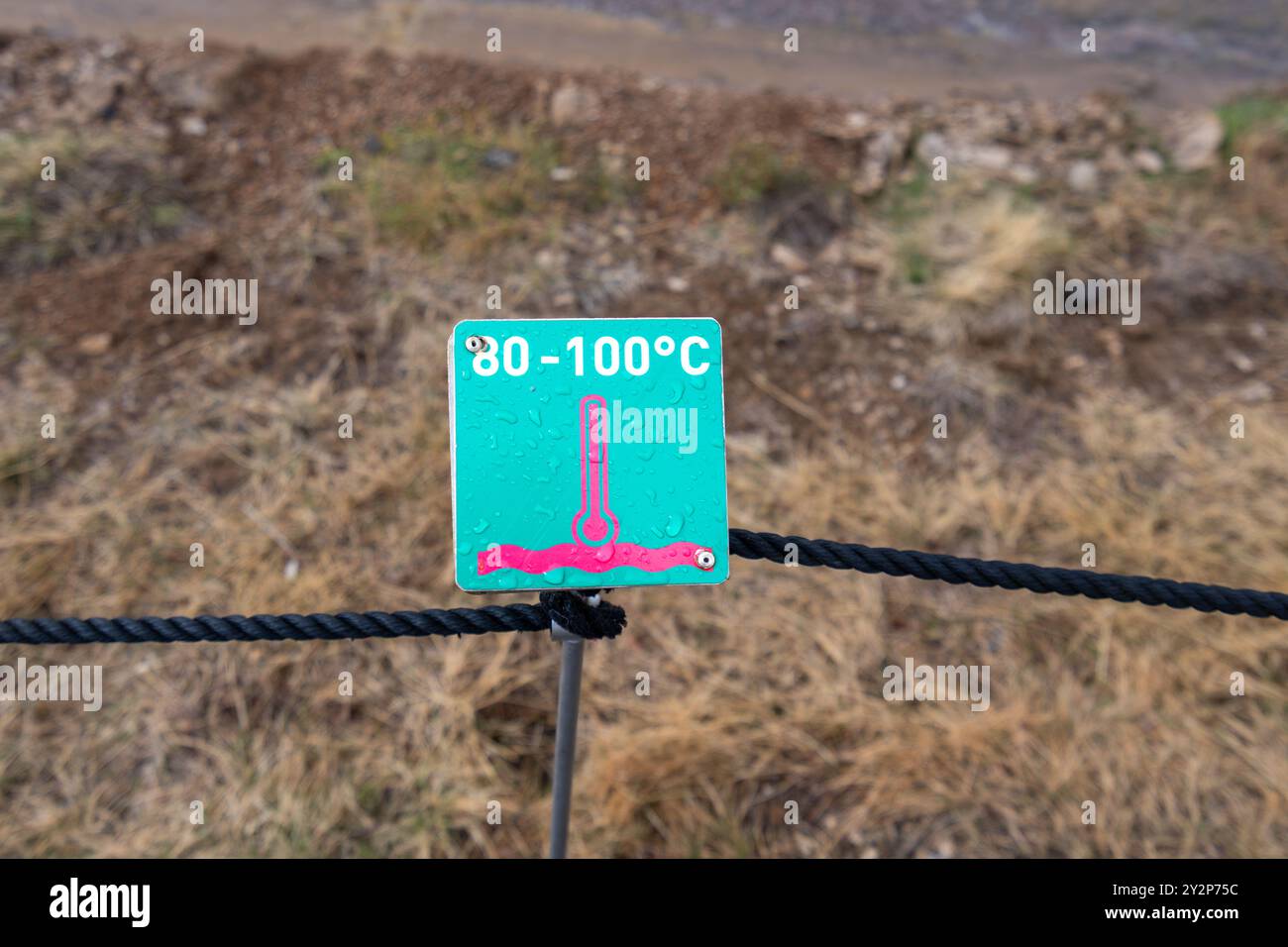 Geysir Geothermal Area, Iceland - May 6, 2024: A warning sign indicates ...