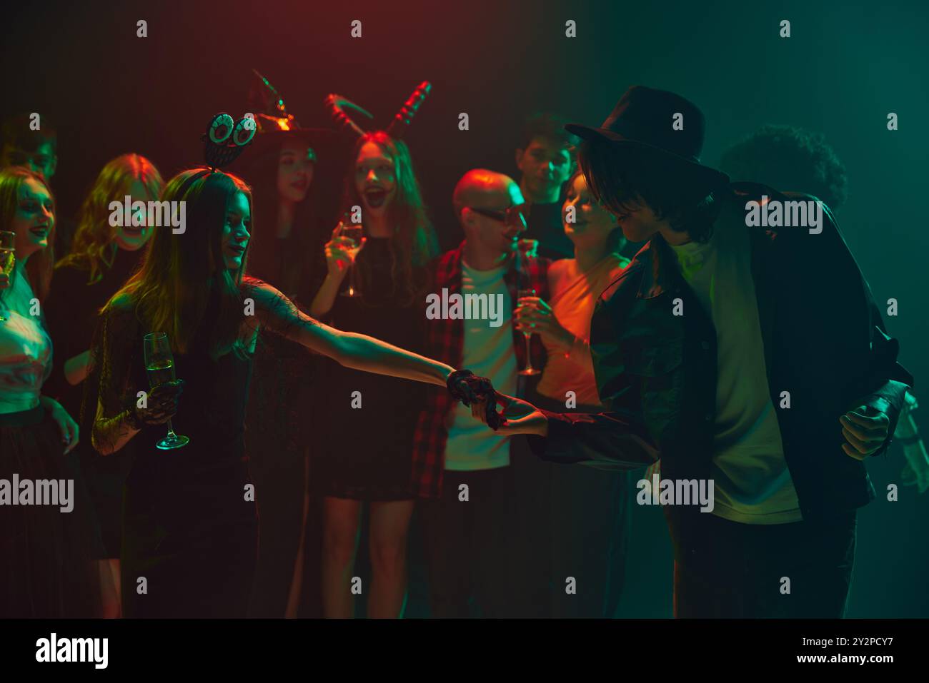 Invitation for a dance. Halloween party scene with young people dressed ...