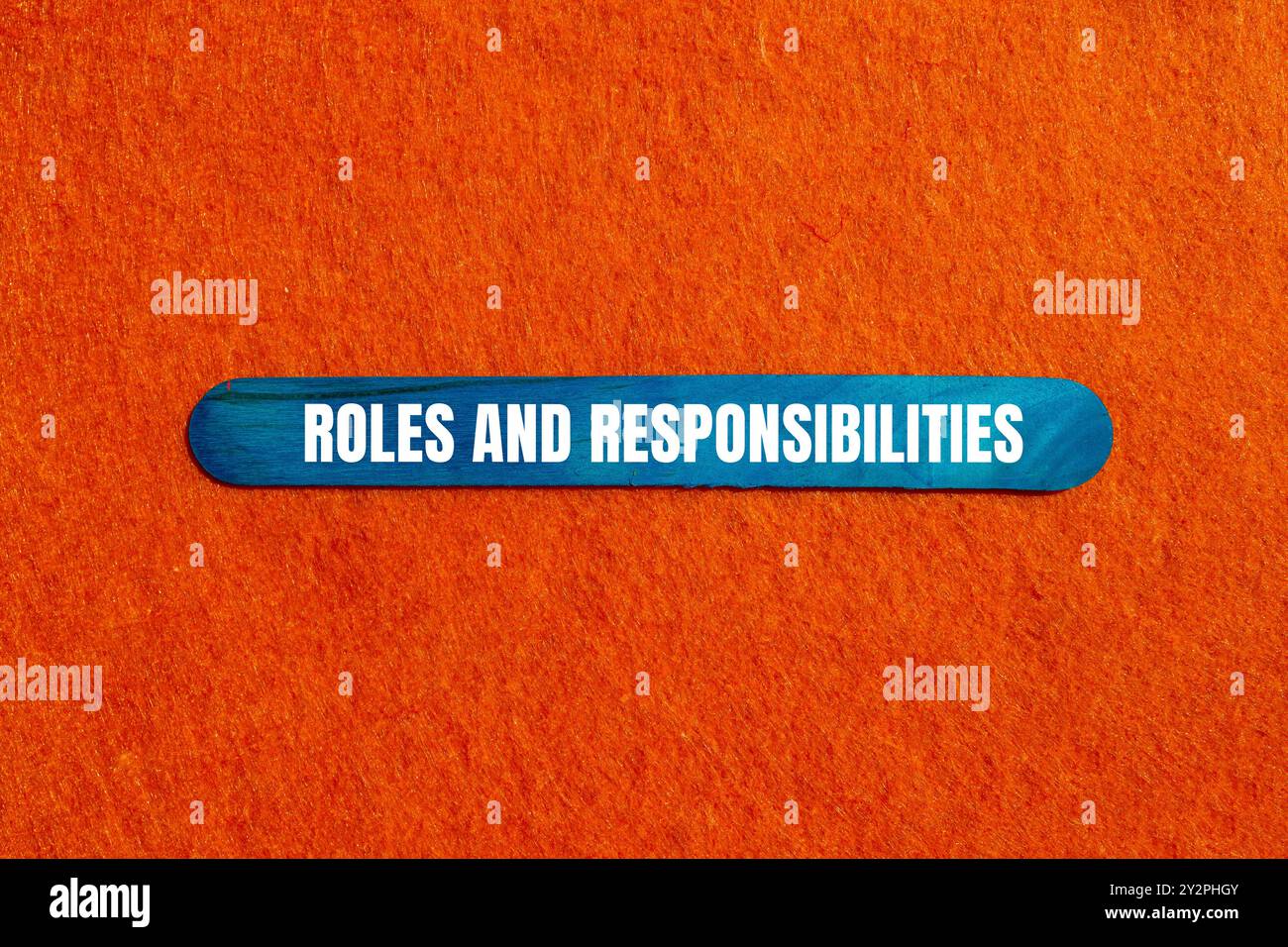 Roles and responsibilities message written on blue wooden stick on ...