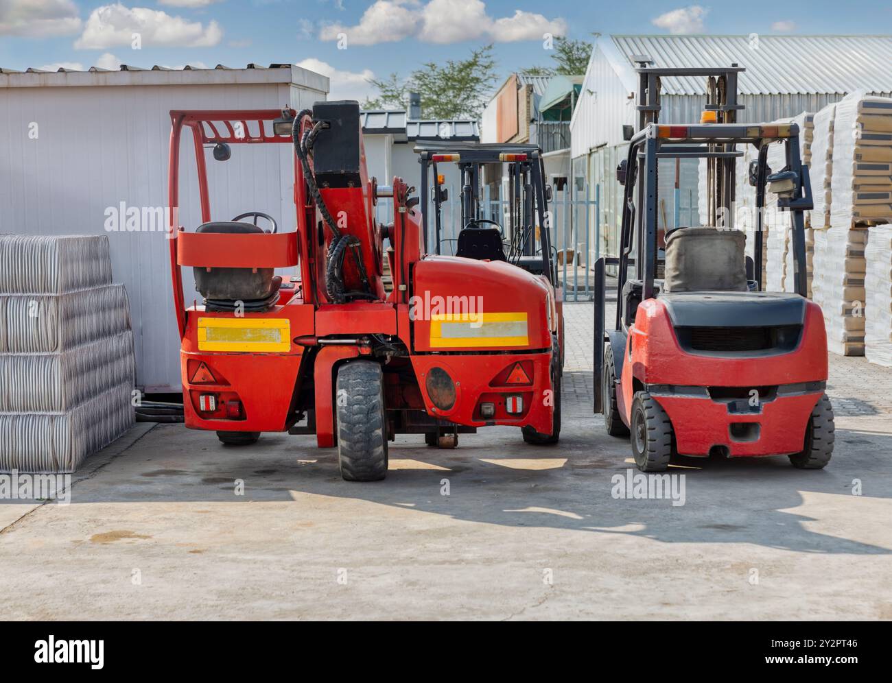two forklift in a depot warehouse with construction materials Stock ...