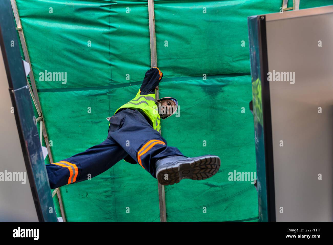 african american worker jumping between roofs view from below Stock ...