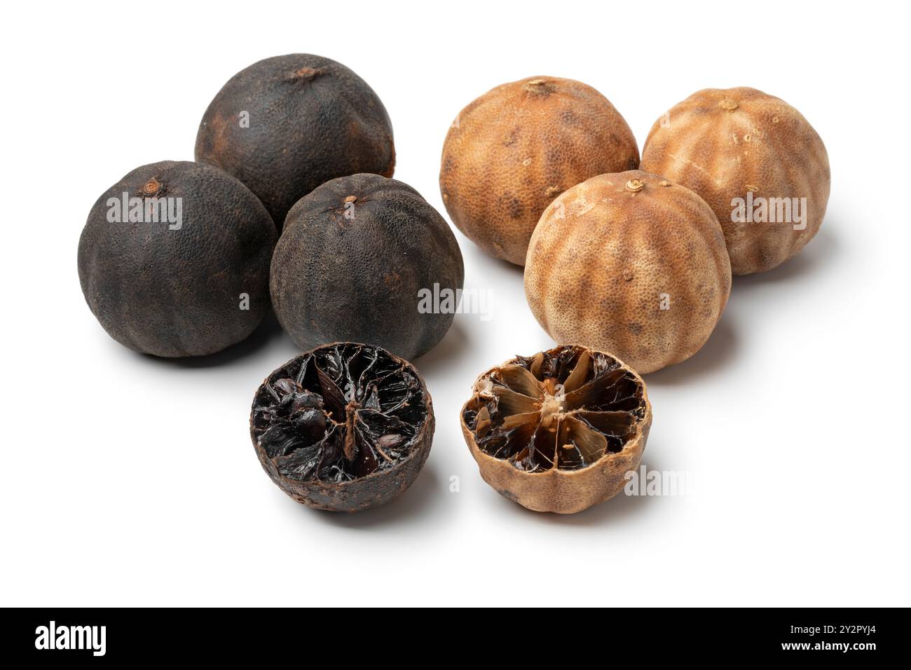 Whole and halved dried black and white limes, loomi, isolated on white ...