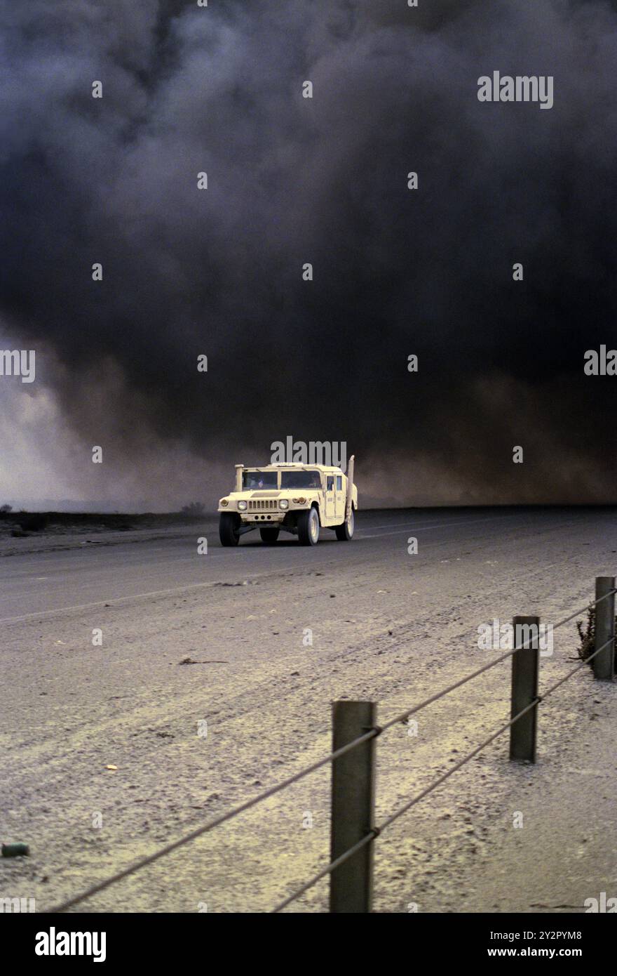 First Gulf War: 7th March 1991 A U.S. Army Humvee drives under clouds ...