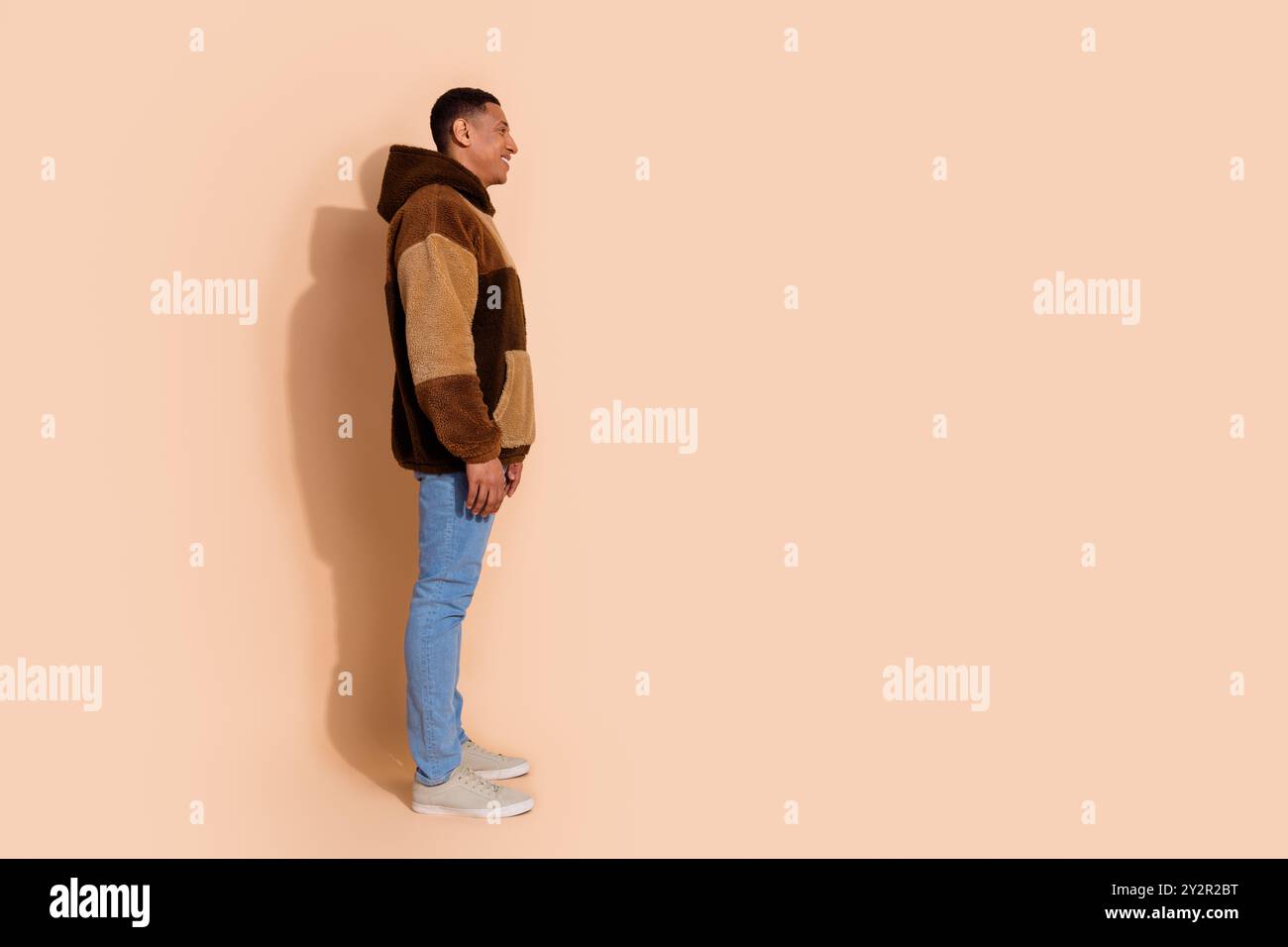 Side profile full length photo of optimistic positive guy dressed plush ...