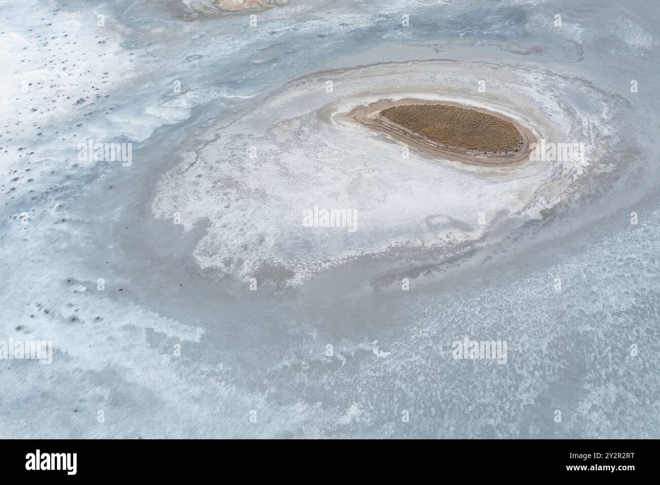 An aerial image showcasing the process of salt extraction in a vast ...