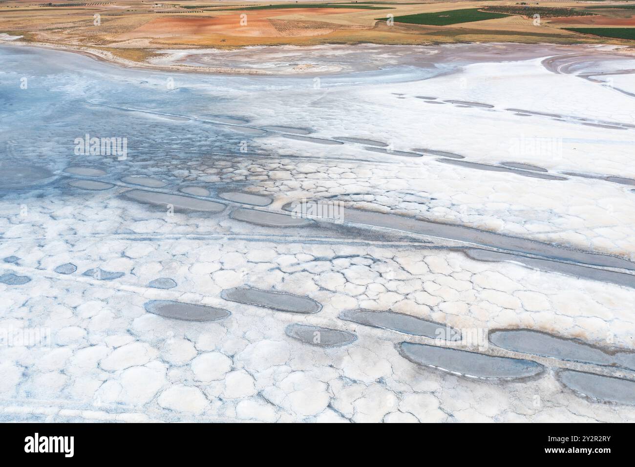 An aerial shot showcasing the intricate pattern of salt extraction ...