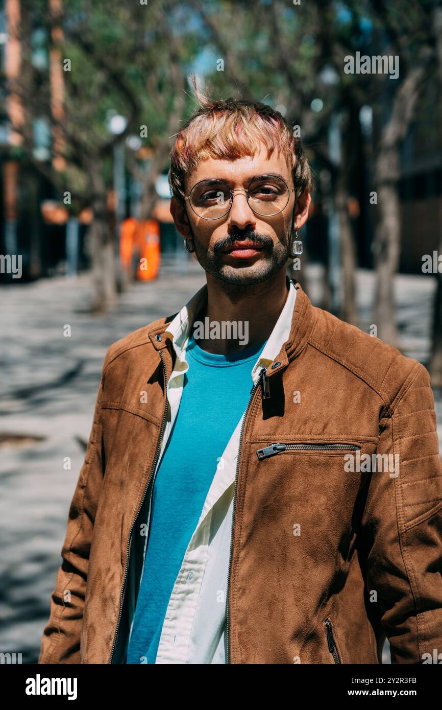 Fashionable man with trendy urban attire, comprising a brown jacket and ...