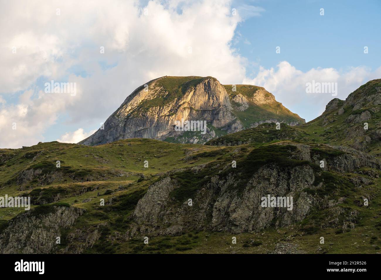 Rugged landscape of the French Pyrenees, showcasing verdant hills and a ...