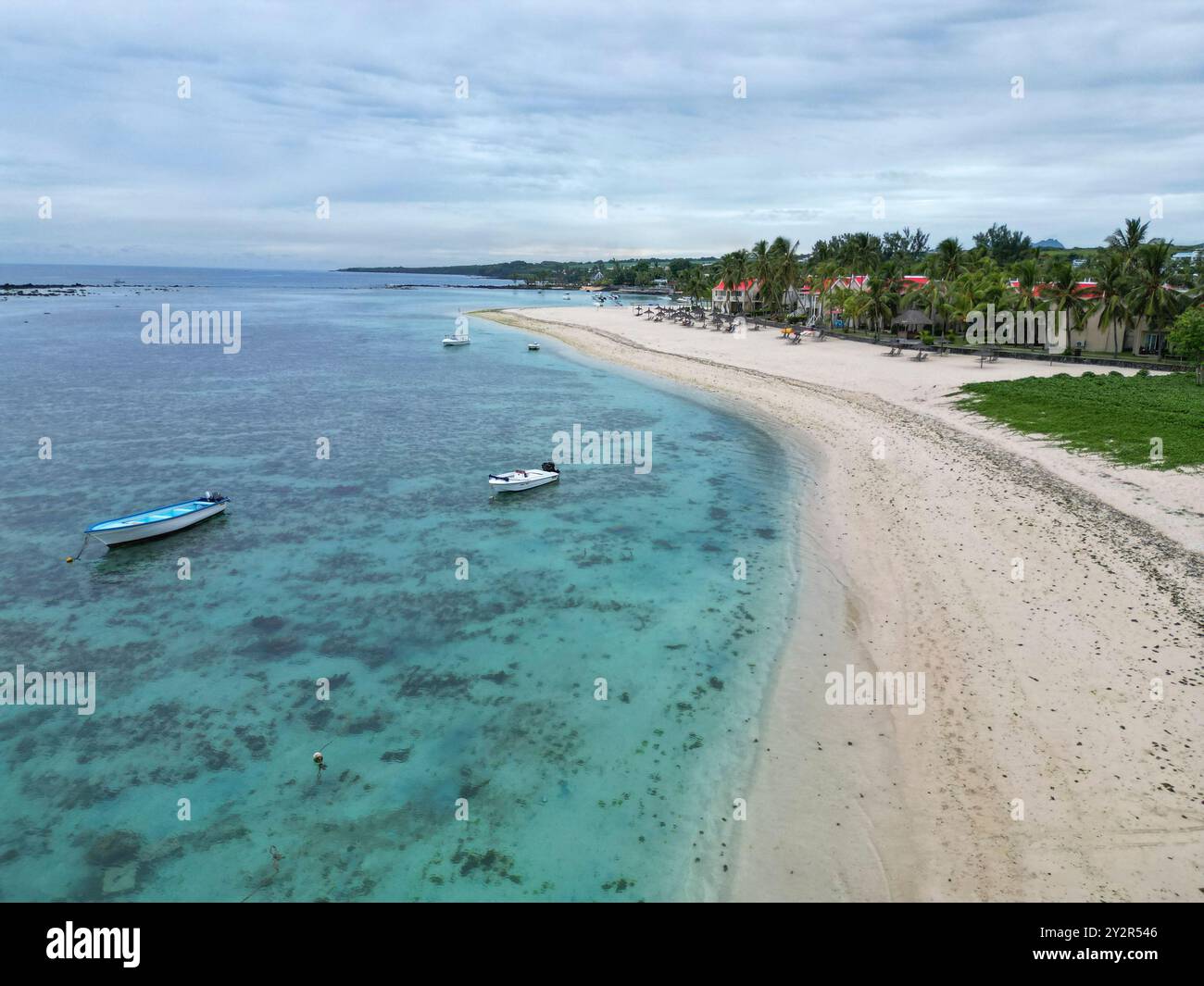 An aerial shot capturing the serene beauty of a sandy beach in ...