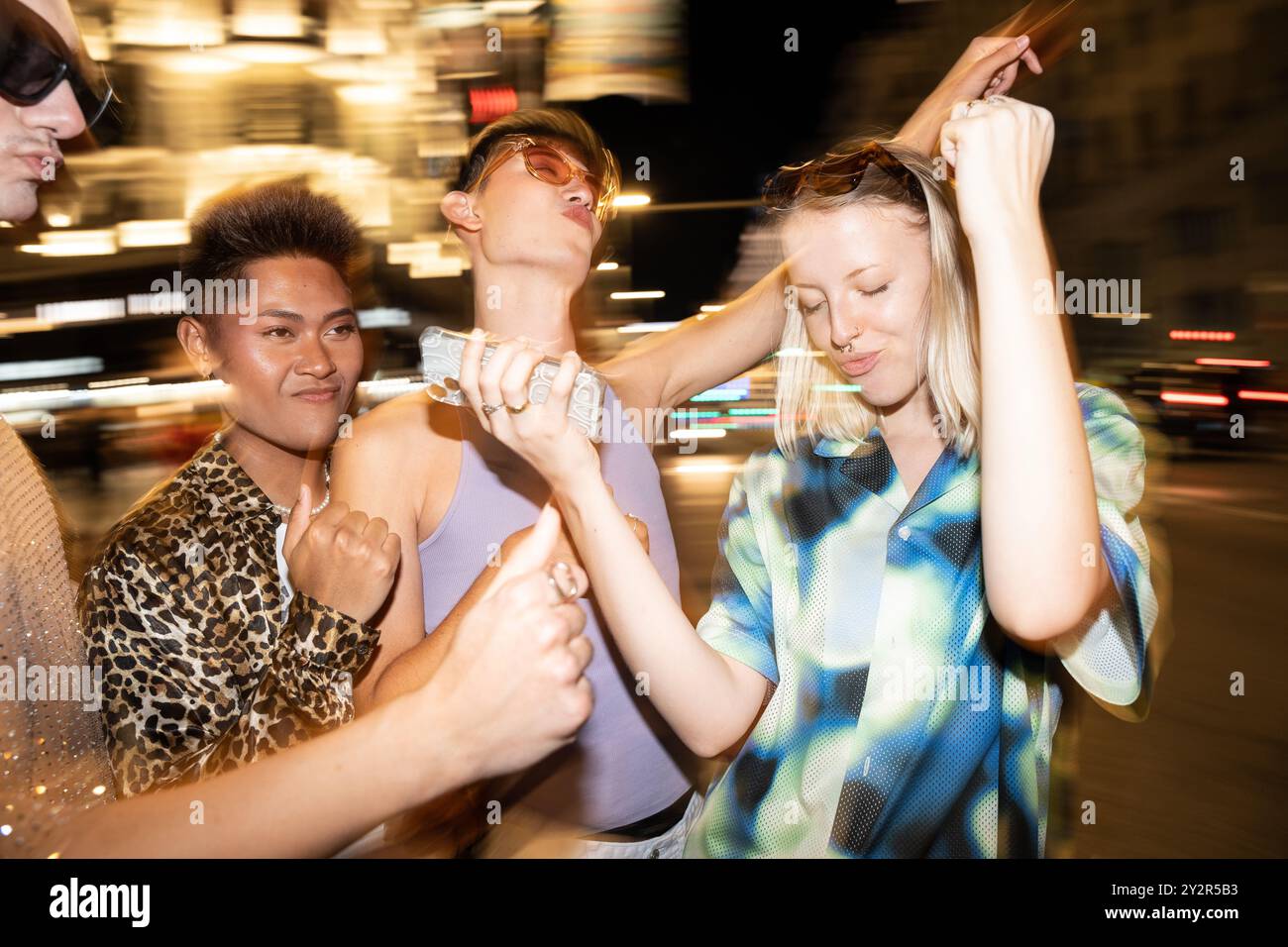 A colorful and lively group of LGBTQIA+ friends enjoying a night out ...