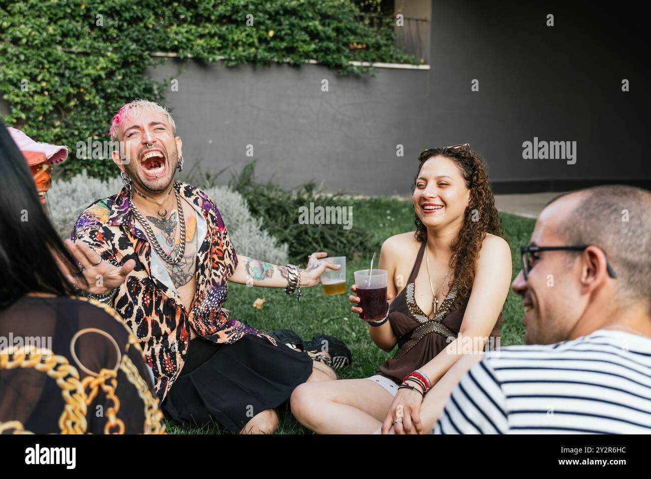 Diverse group of friends laughing and sharing a joyful moment at an ...