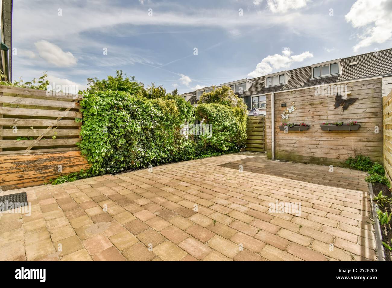 This image showcases a well-maintained suburban backyard featuring ...