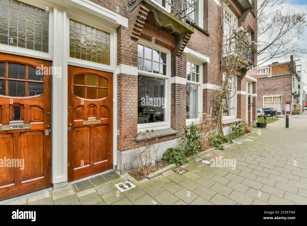 Classic European architecture featuring brick houses with ornate wooden ...