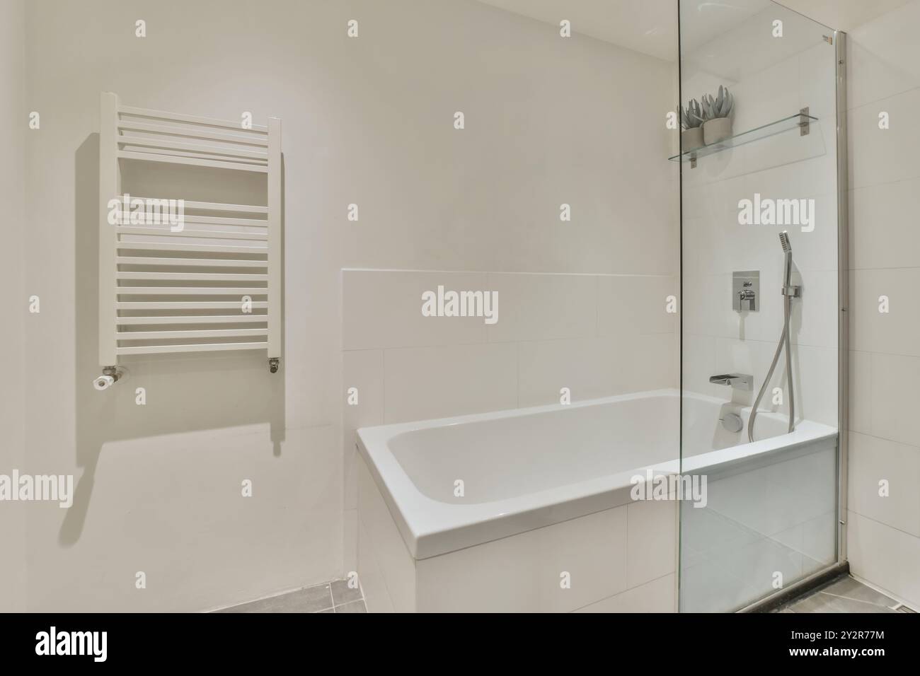 A sleek and stylish modern bathroom, featuring a white bathtub and ...