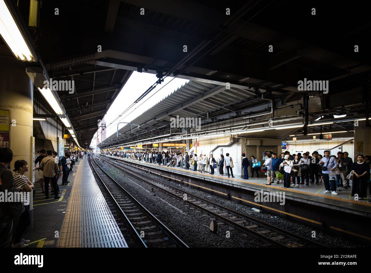 TOKYO, JAPAN - MAY 11, 2019: Shinjuku train station platform and ...