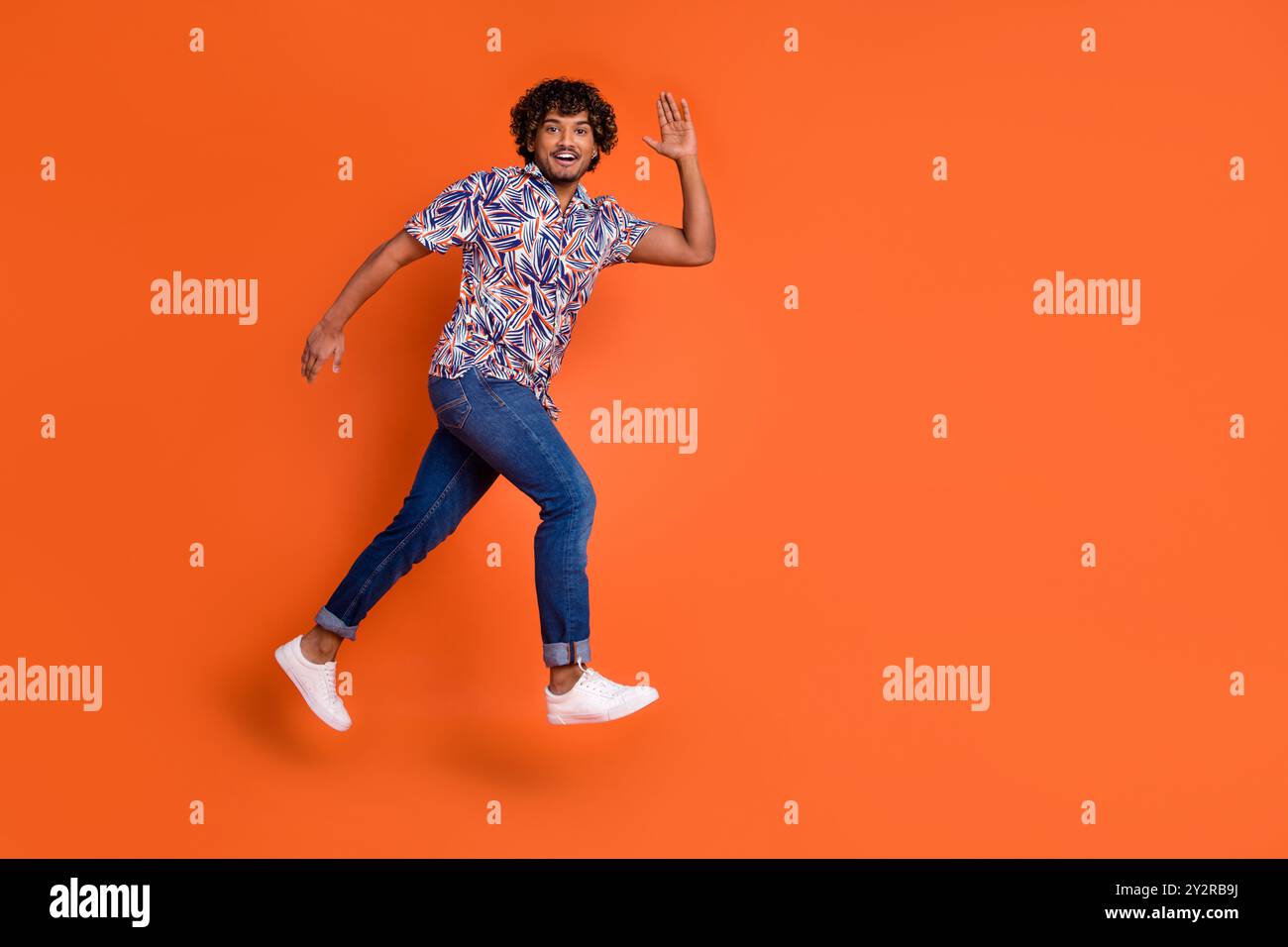 Full size photo of nice young man running wave hand wear trendy ...