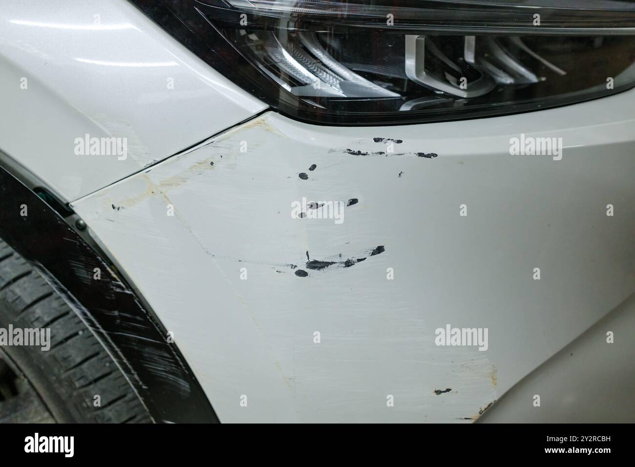 The front of white modern SUV car suffered damage and broken to bumper ...