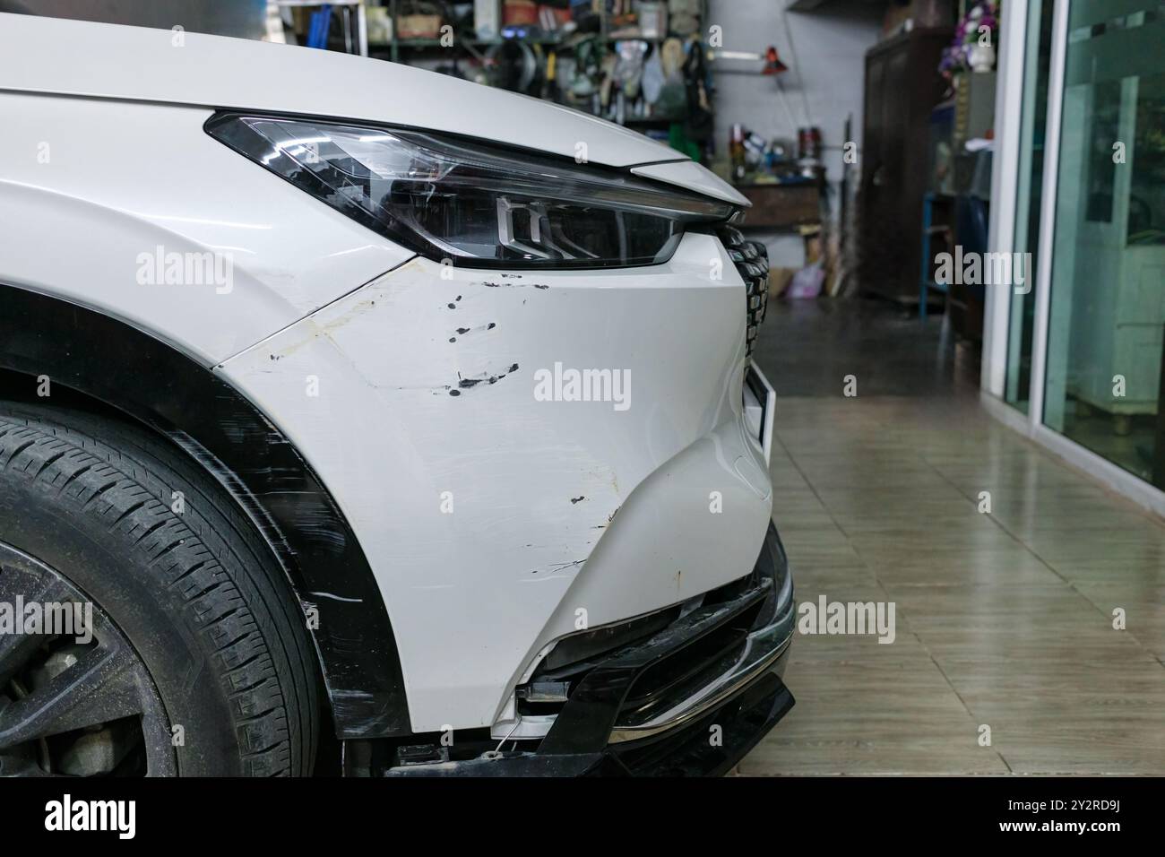 The front of white modern SUV car suffered damage and broken to bumper ...