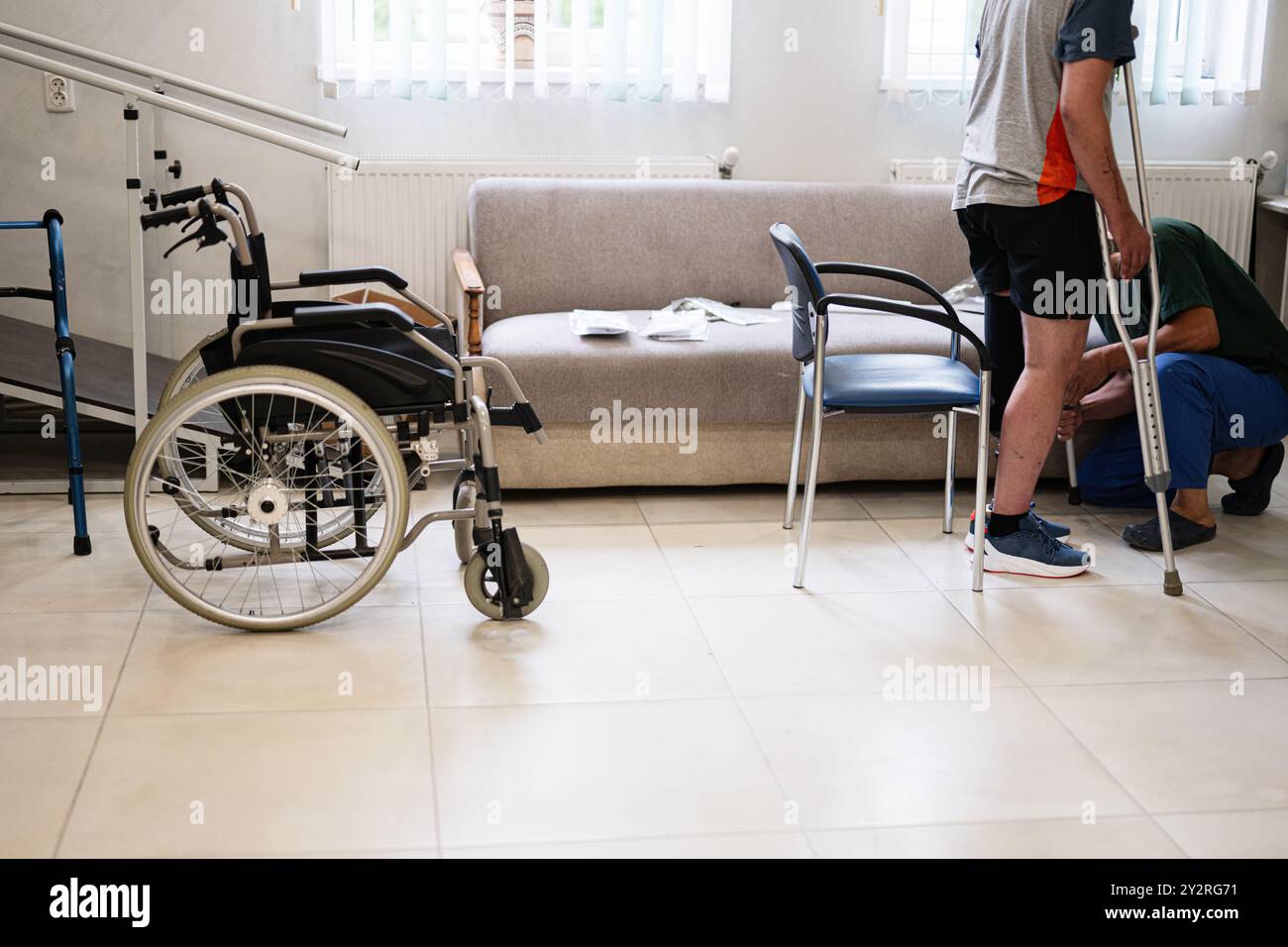 Patient undergoing physical therapy in a rehabilitation center, using ...
