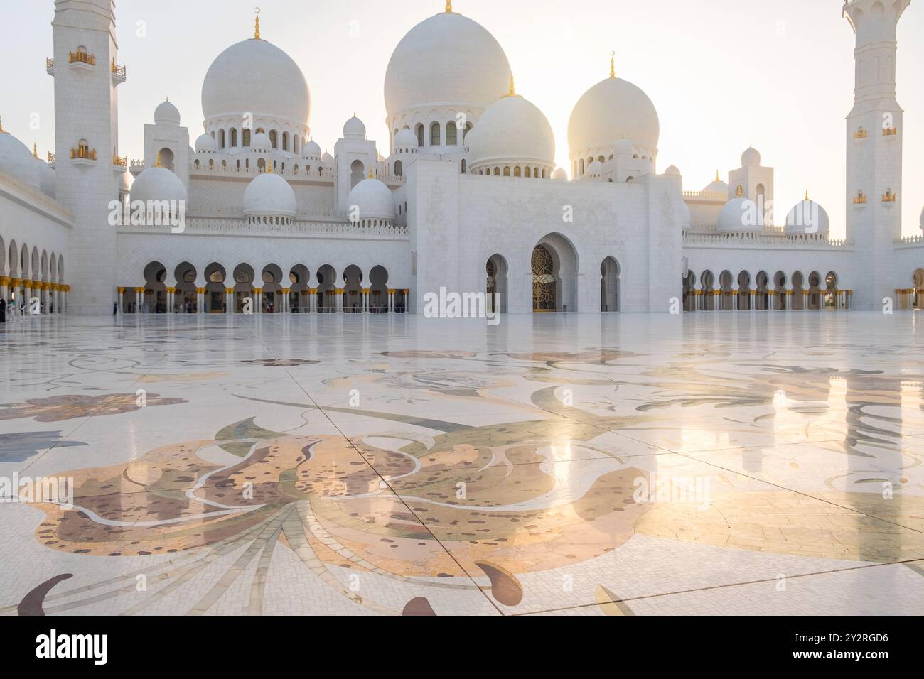 Courtyard of Sheikh Zayed Grand Mosque in Abu Dhabi, UAE with white ...