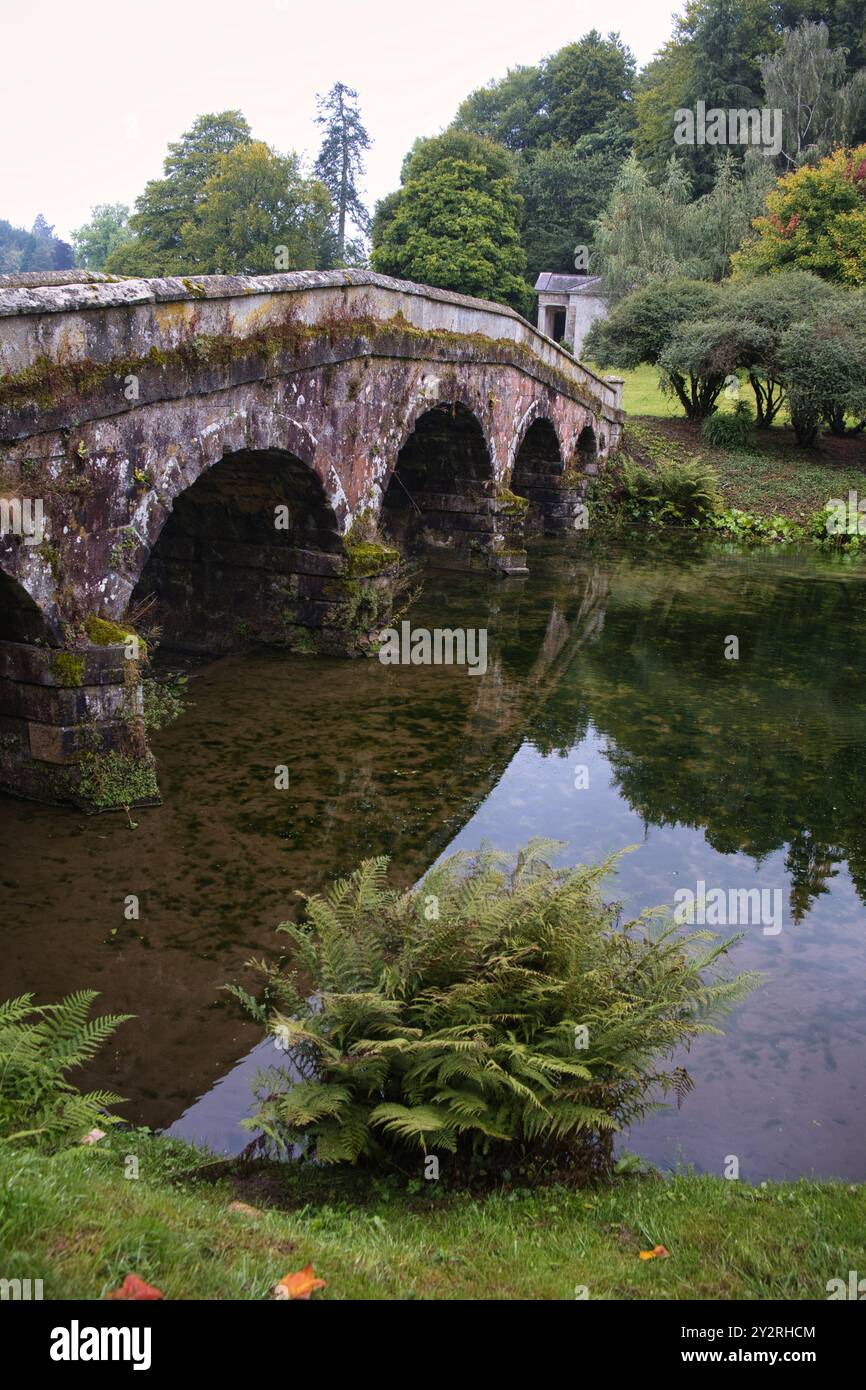 The Palladian Bridge in Stourhead in Wiltshire on a misty Summer ...