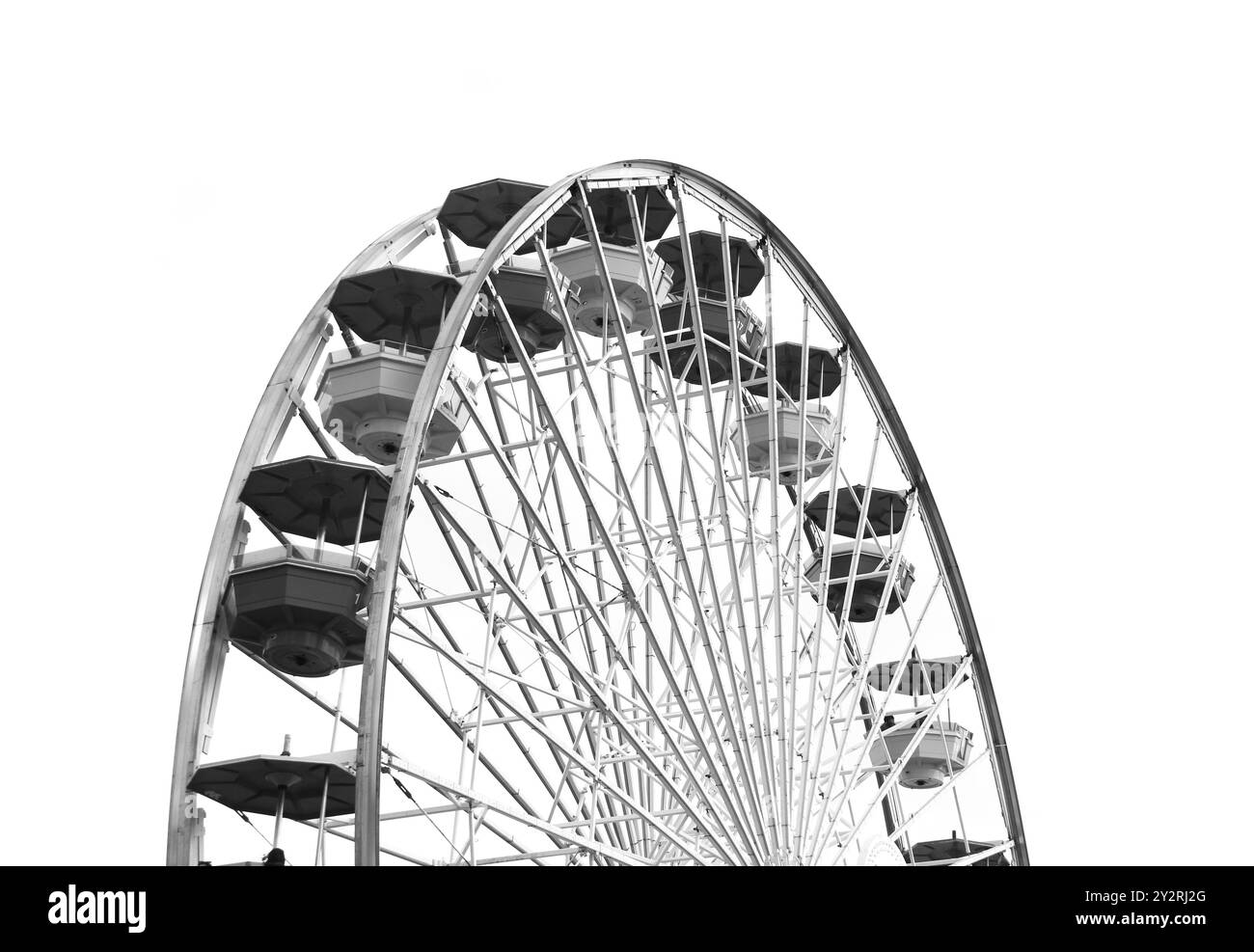 Black and white photograph of a Ferris wheel against a clear sky ...