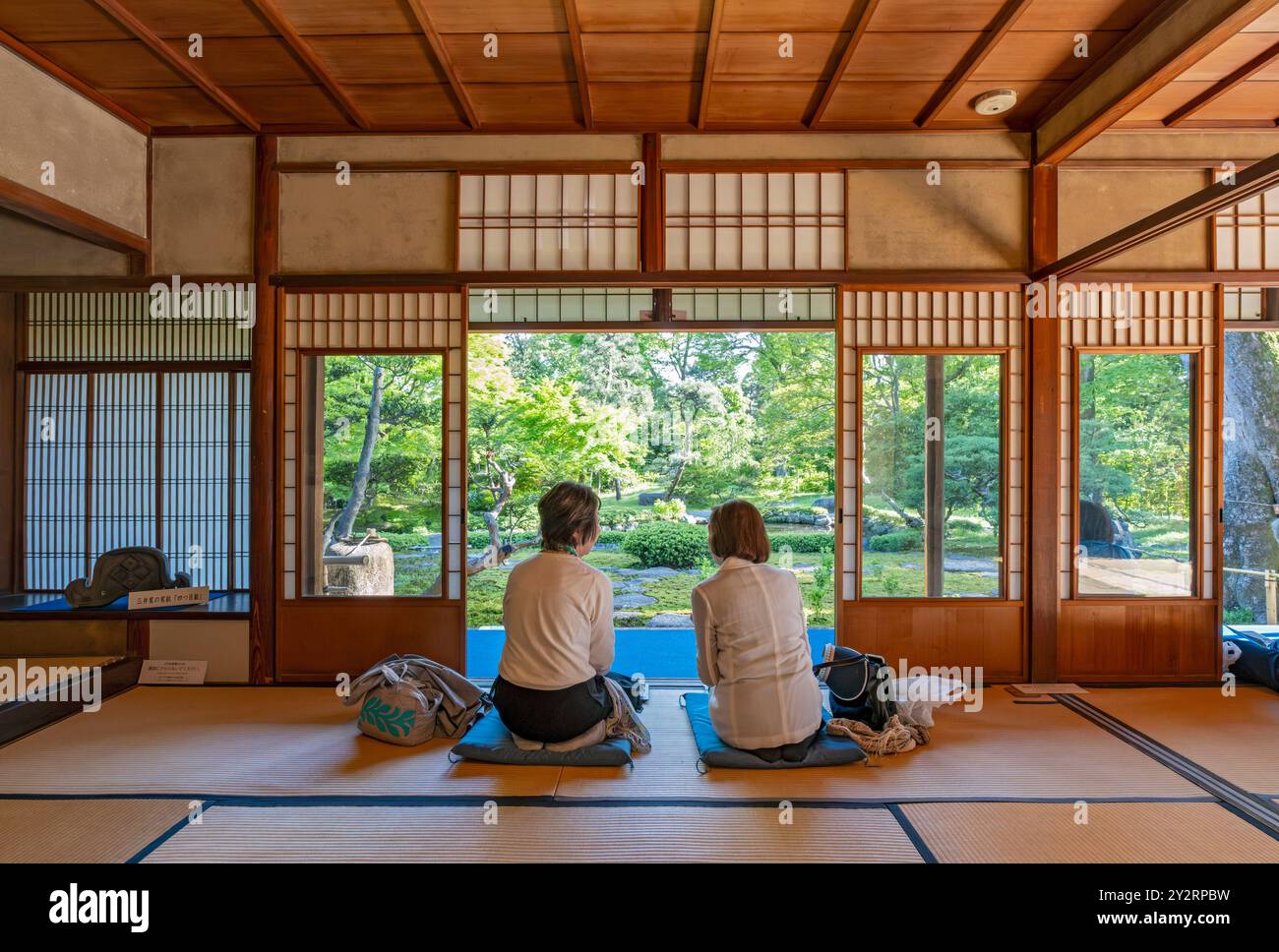 Two women enjoy tea inside the Old Mitsui Family Shimogamo Villa, Kyoto ...