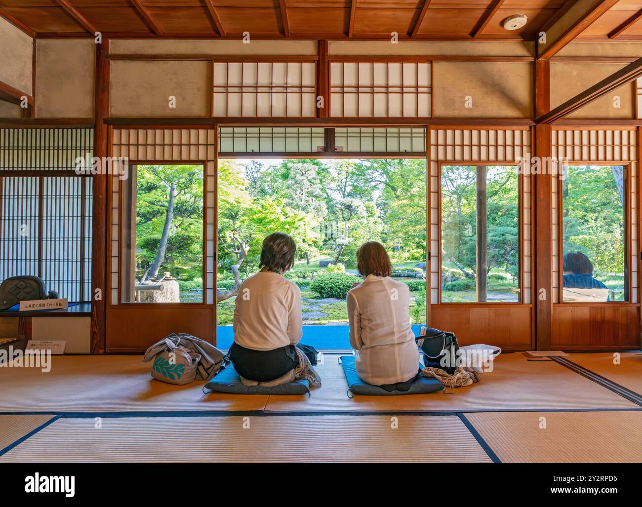 Two women enjoy tea inside the Old Mitsui Family Shimogamo Villa, Kyoto ...