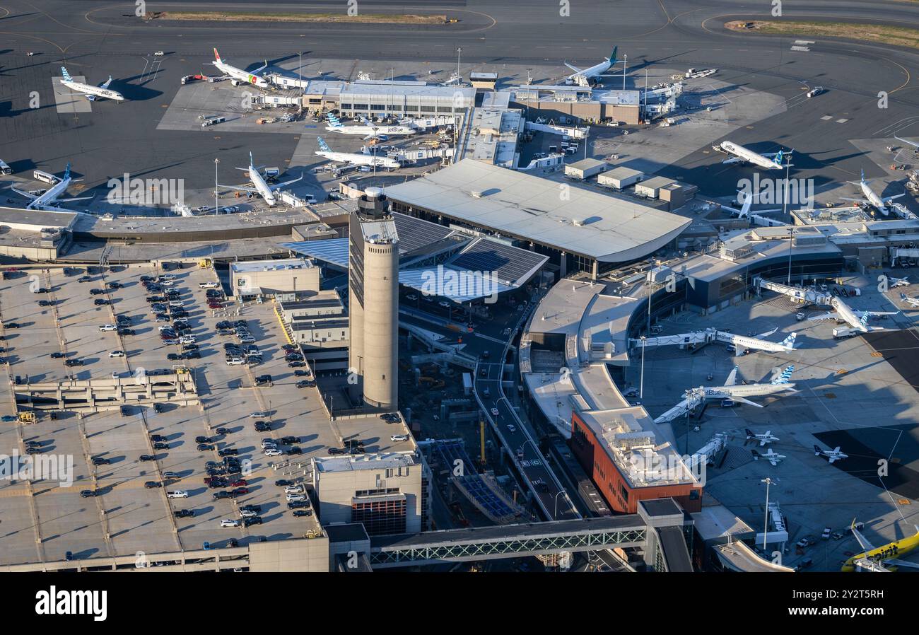 An aerial view of Logan Airport in Boston showing terminal, planes, air ...
