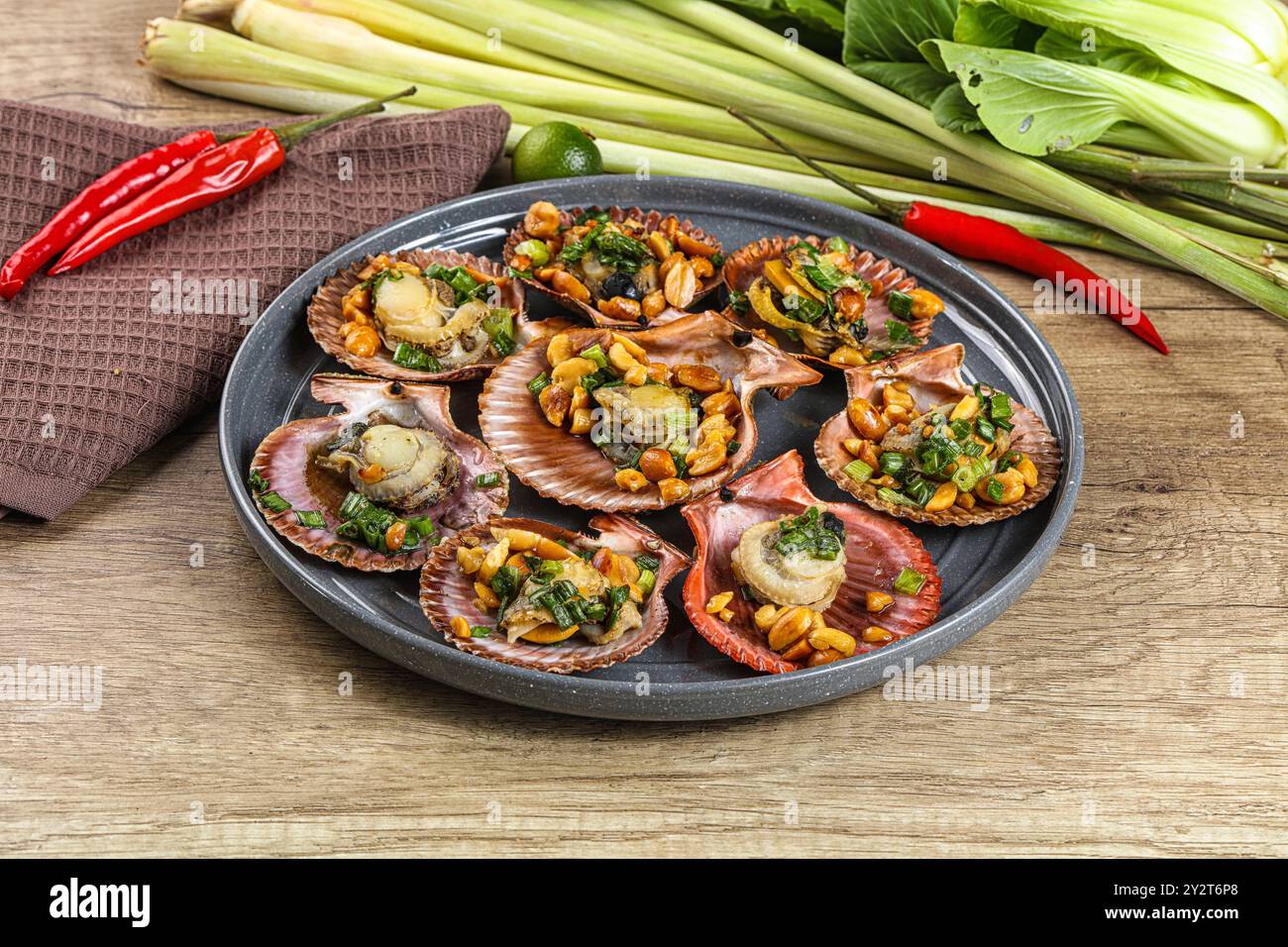 Baked scallops with scalion oil and green onion Stock Photo - Alamy