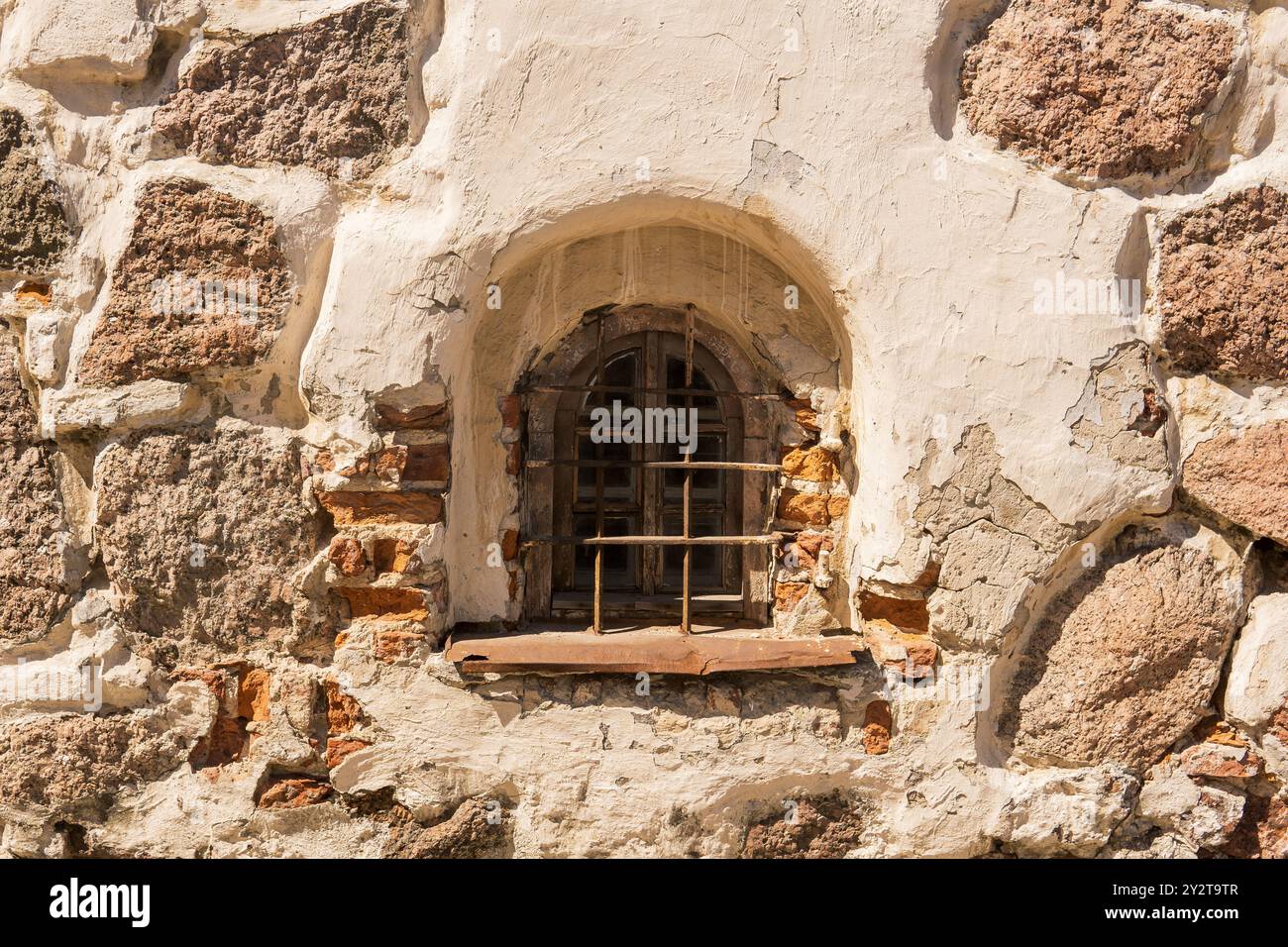 small window in the stone wall of a medieval building Stock Photo - Alamy