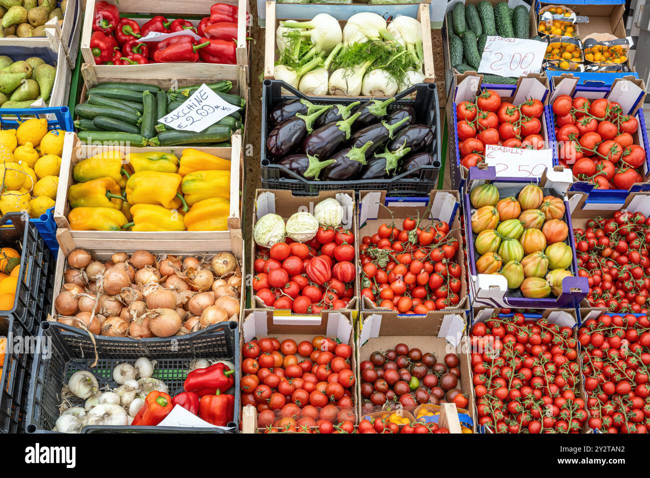 Colorful variety of tomatoes and other vegetables seen at a market in ...