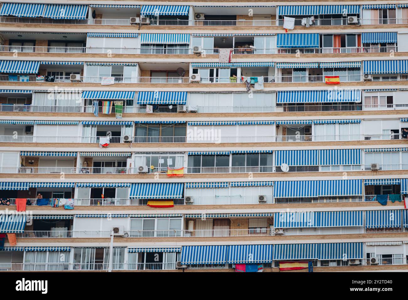 A multi-story residential building in Alicante, Spain featuring blue ...