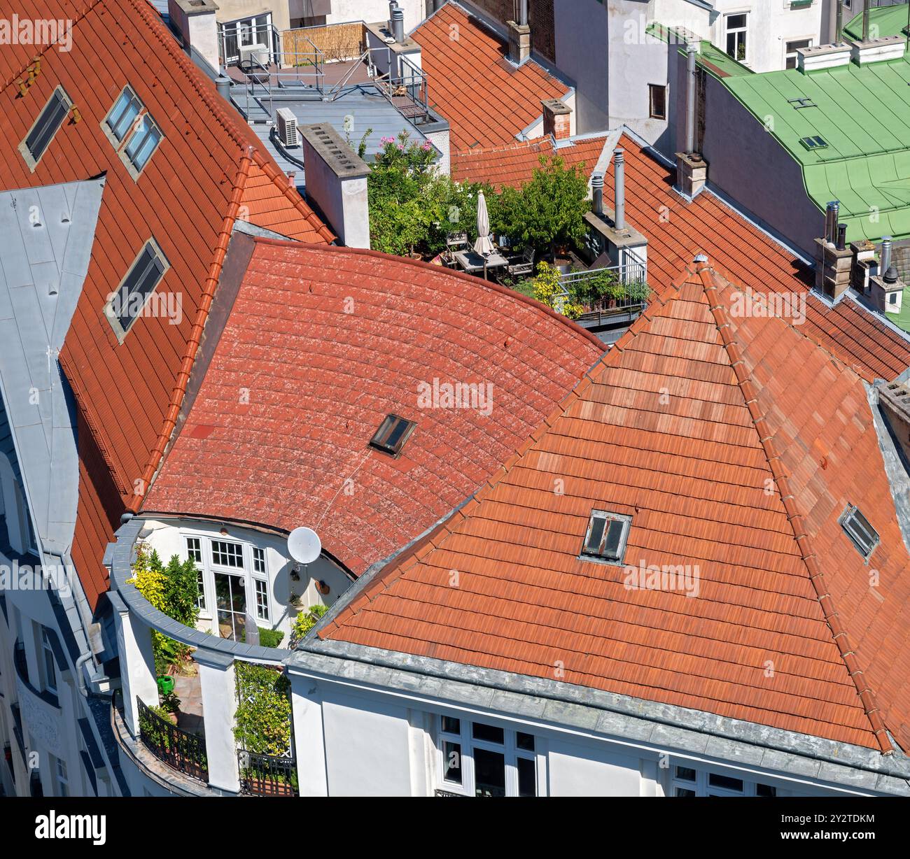 view onto red tiled roofs and small roof gardens at the Viennese ...