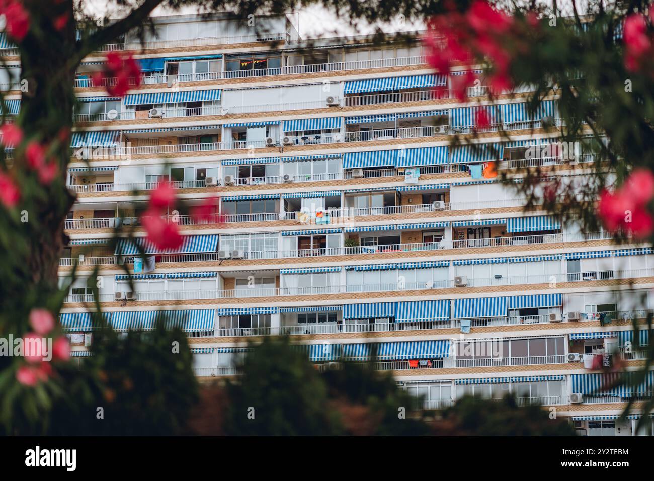Striped awnings of a residential building in Alicante, Spain, seen ...
