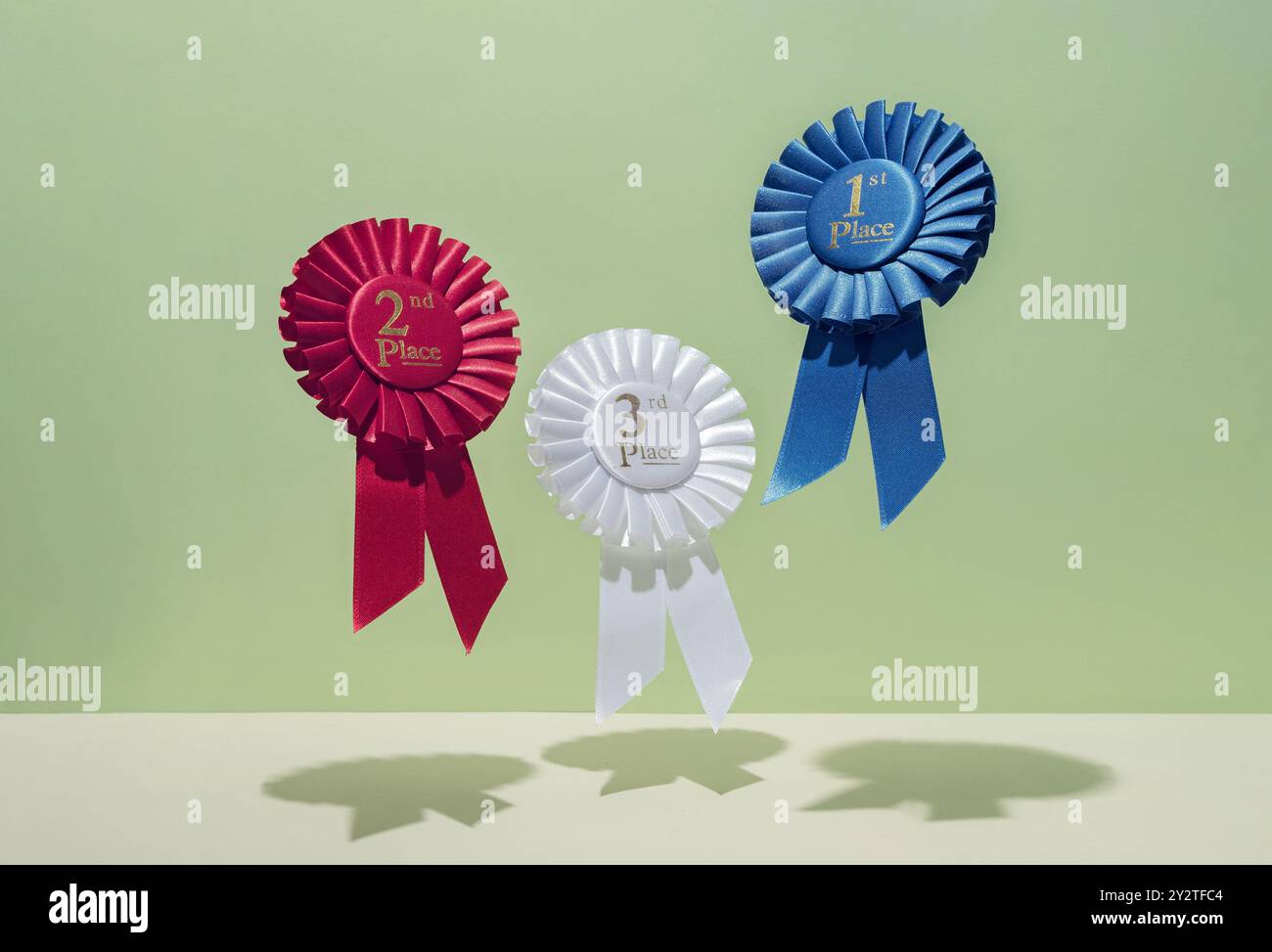 First, second, and third place award ribbons in blue, red, and white on ...