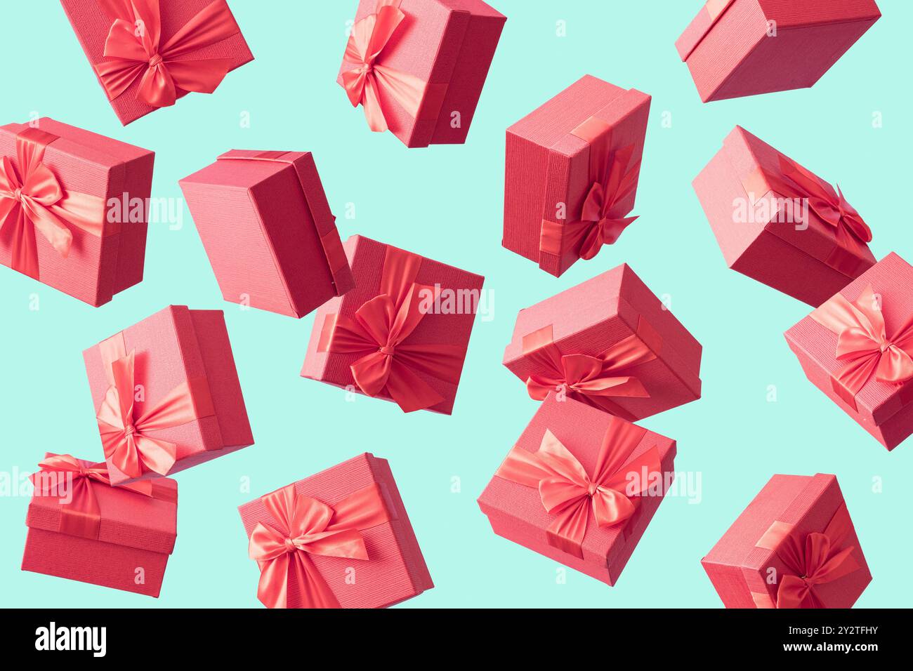 Floating red gift boxes with ribbons on a light blue background Stock ...